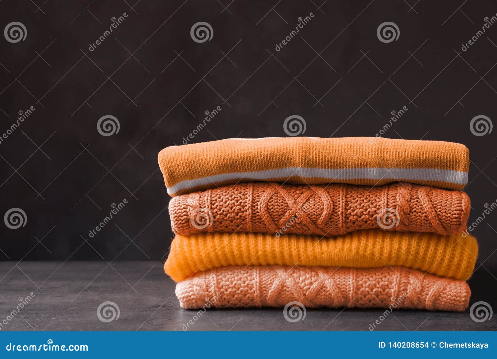 Stack of Folded Knitted Sweaters on Table. Stock Photo - Image of ...