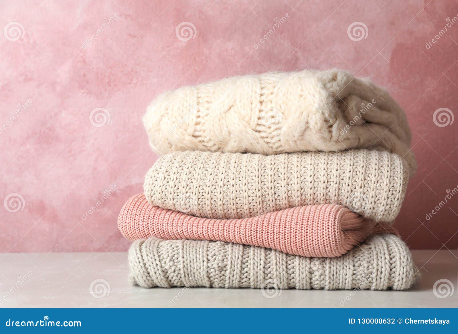 Stack of Folded Knitted Sweaters on Table Stock Photo - Image of ...