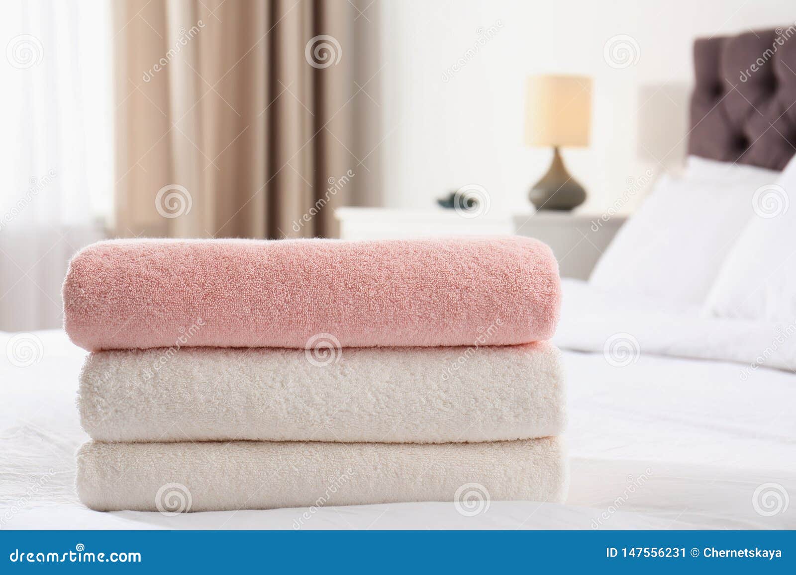 Stack of Folded Soft Towels on Bed in Room Stock Image - Image of hotel ...