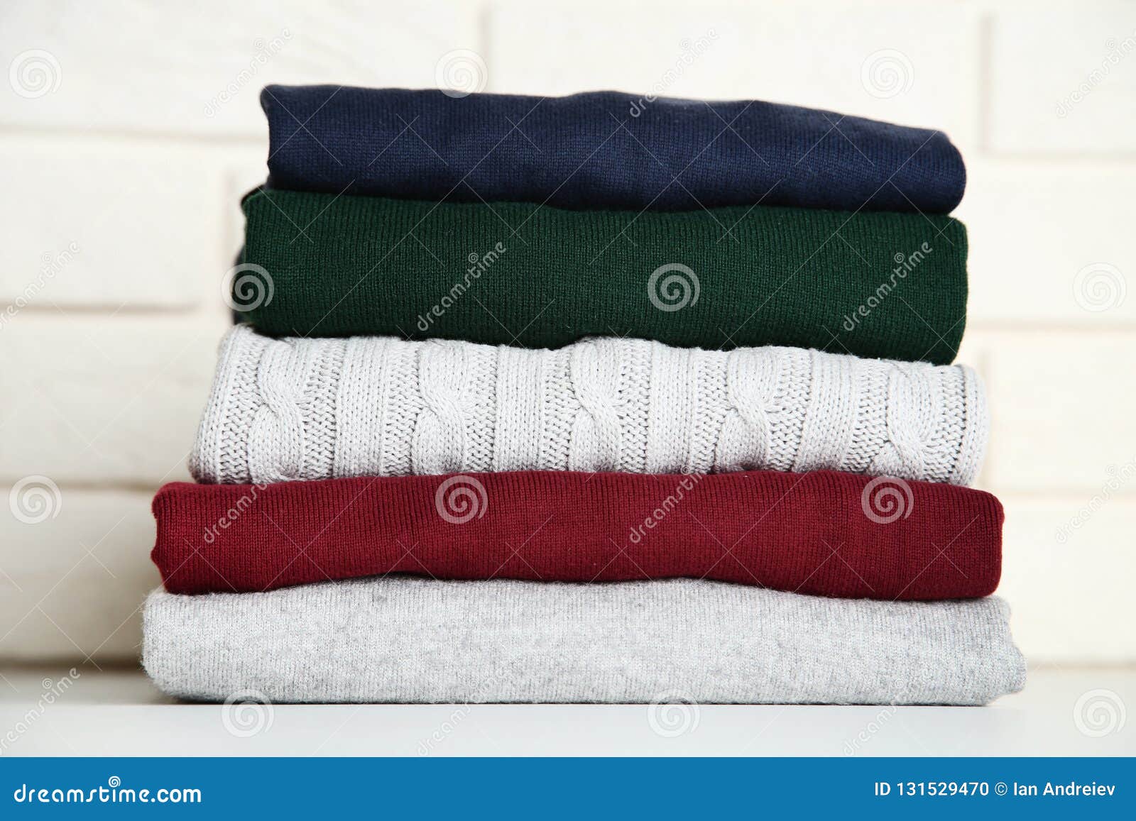 Folded sweaters stock photo. Image of object, grey, home - 131529470