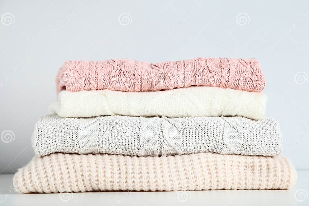 Folded sweaters stock image. Image of pattern, fabric - 131529303