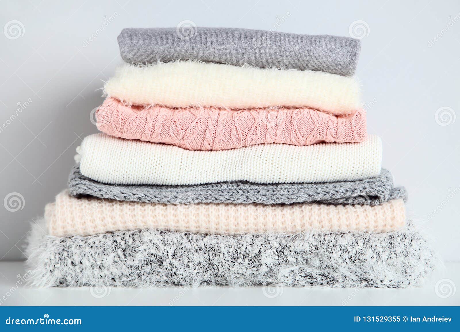 Folded sweaters stock image. Image of color, grey, laundry - 131529355