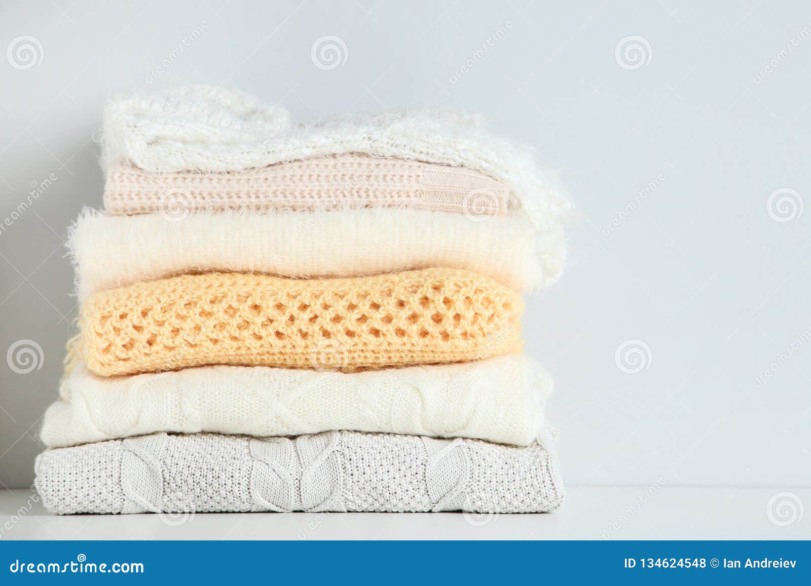 Stack of folded sweaters stock photo. Image of shape - 134624548