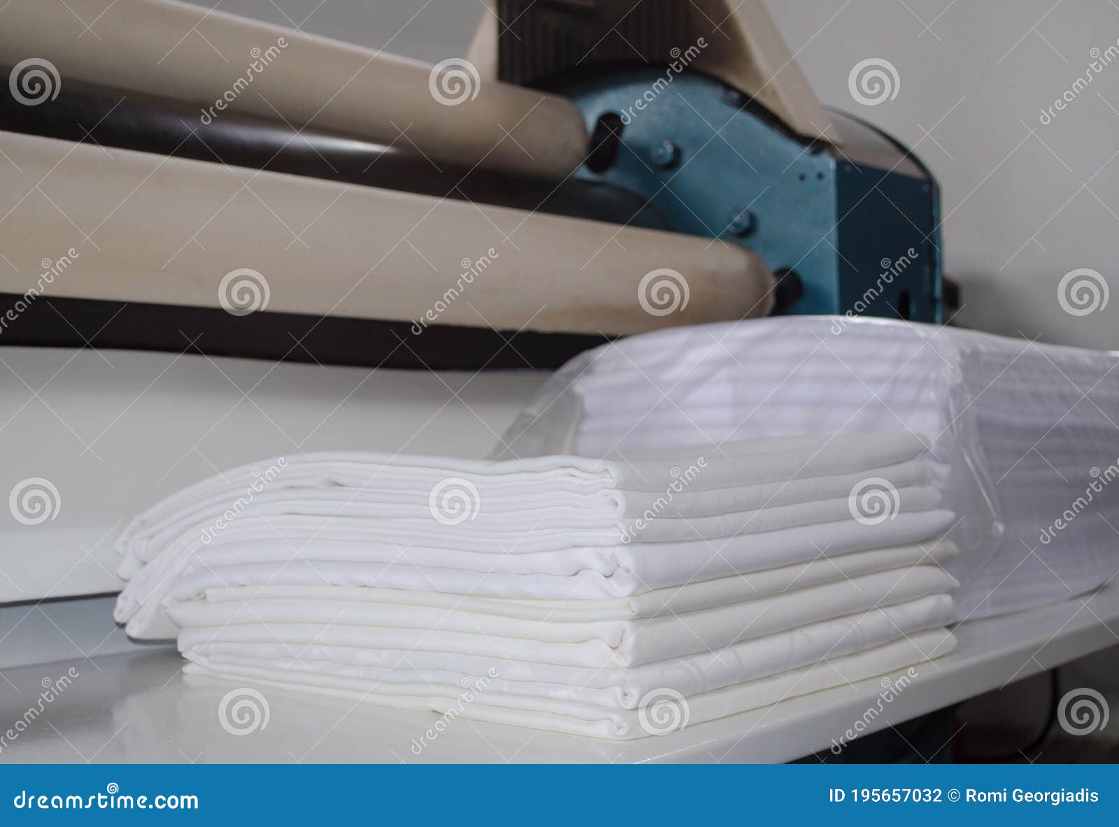 Stack of Folded White Fabrics in an Industrial Laundry Stock Photo ...