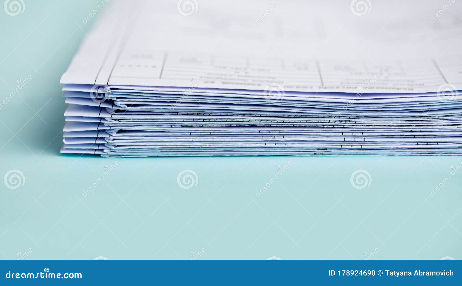 Stack Folding Drawings on a Blue Background. Copy Space Stock Photo ...