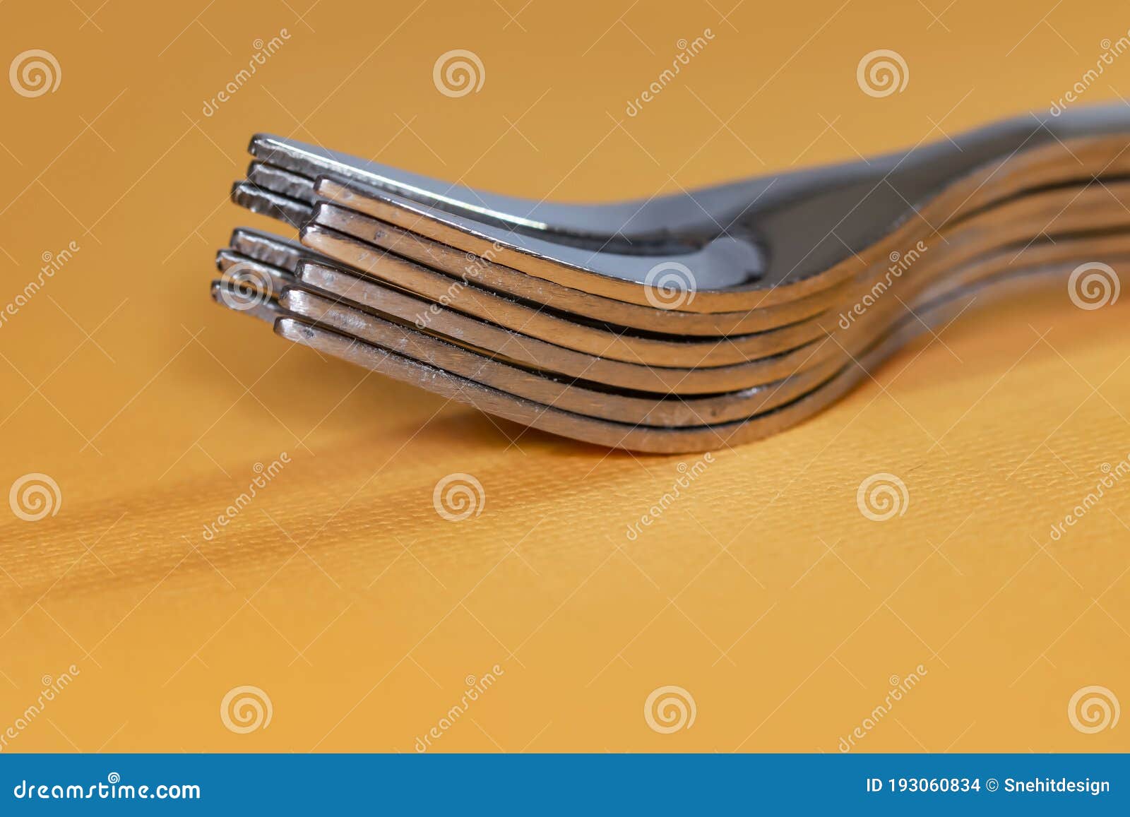 Stack of Forks Isolated on Yellow Background Stock Photo - Image of ...