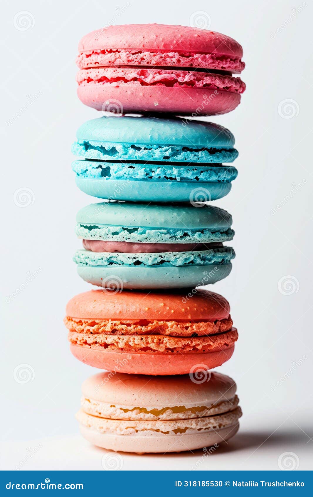 A Stack of Four Different Colored Macarons. the Macarons are Pink, Blue ...