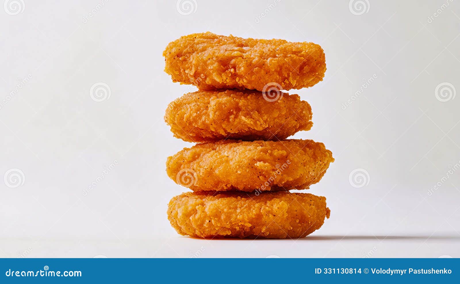A Stack of Four Pieces of Chicken Nuggets Stacked on Top of Each Other ...