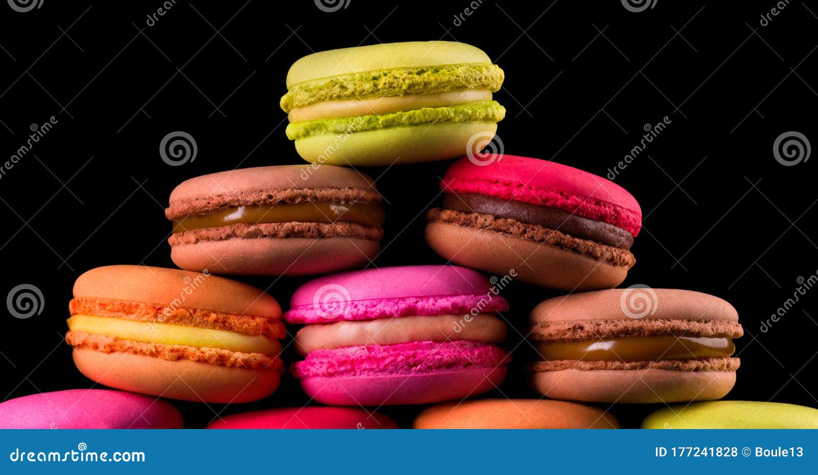 Stack of French Colorful Macaroons in Row Isolated on Black Background ...