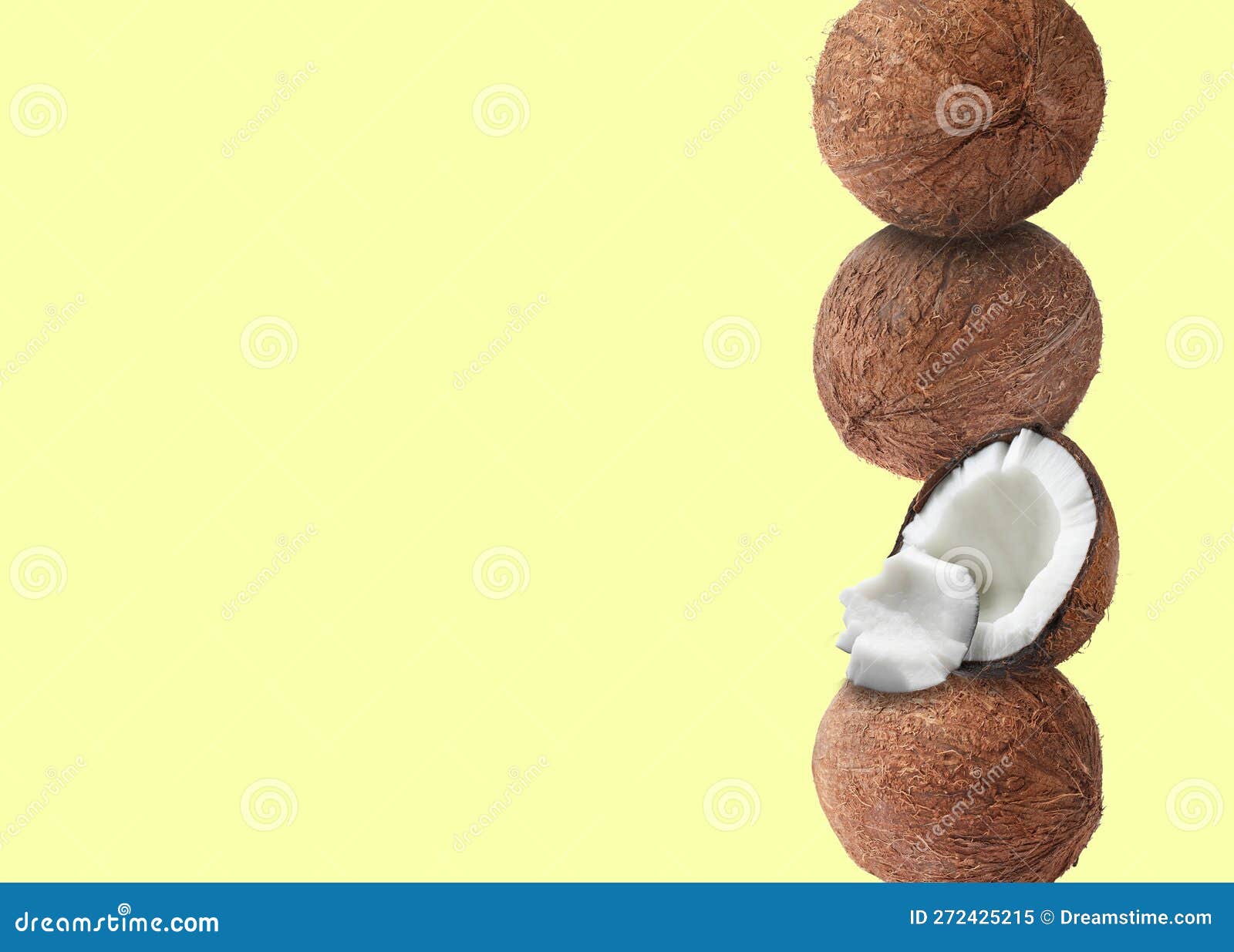 Stack of Fresh Coconuts on Pale Light Yellow Background. Space for Text ...