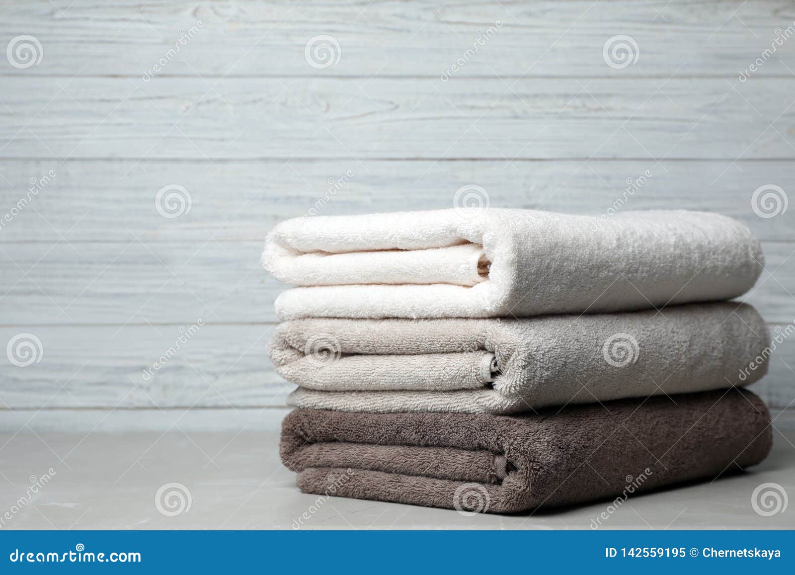 Stack of Fresh Towels on Table Stock Image - Image of cotton, shower ...