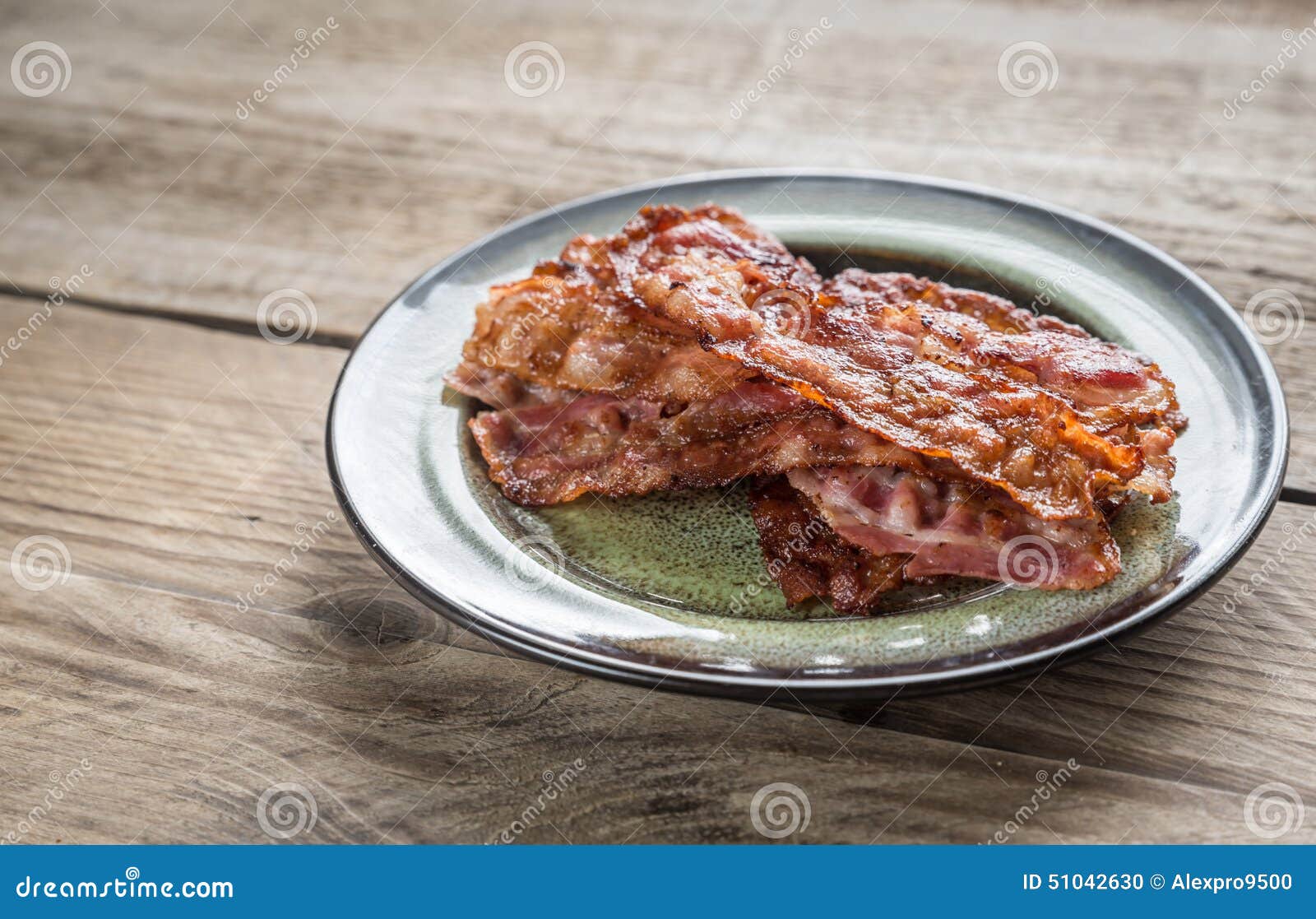 Stack of Fried Bacon Strips on the Plate Stock Photo - Image of pile ...