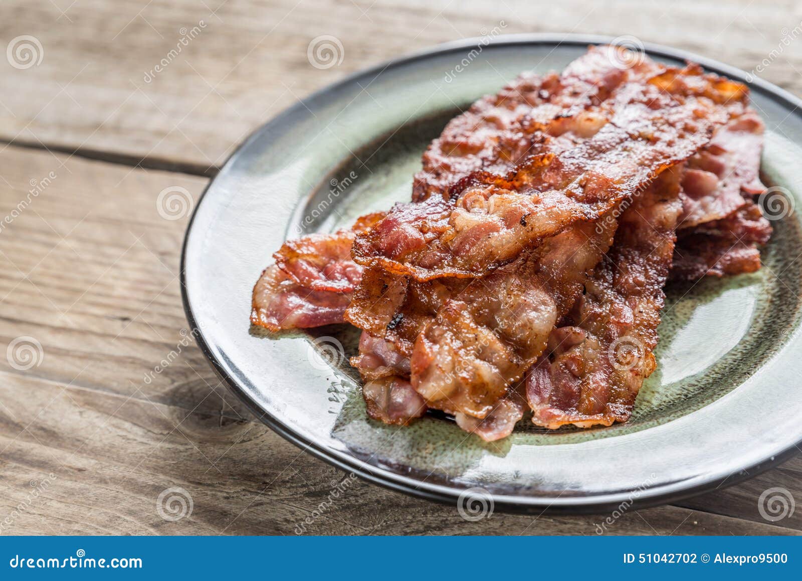 Stack of Fried Bacon Strips on the Plate Stock Photo - Image of ...