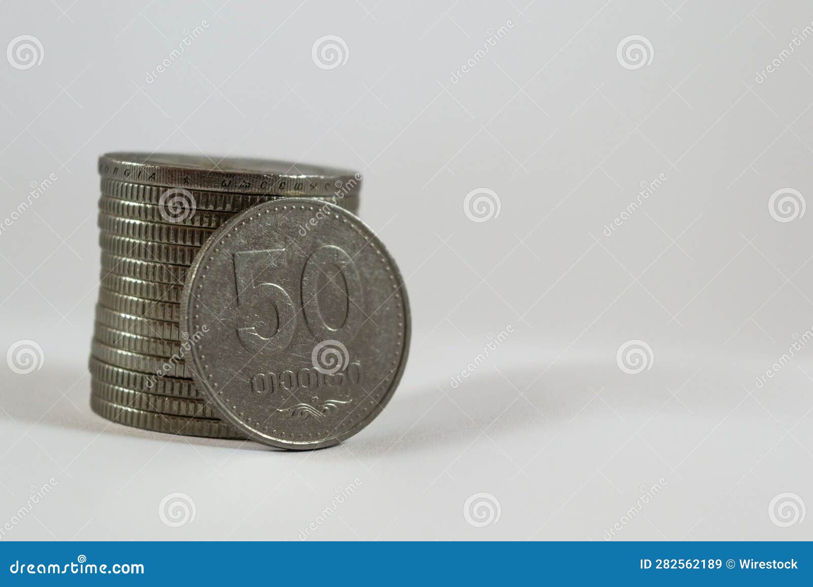 Stack of Georgian Lari Coins with a 50 Lari Coin Leaning on it on a ...