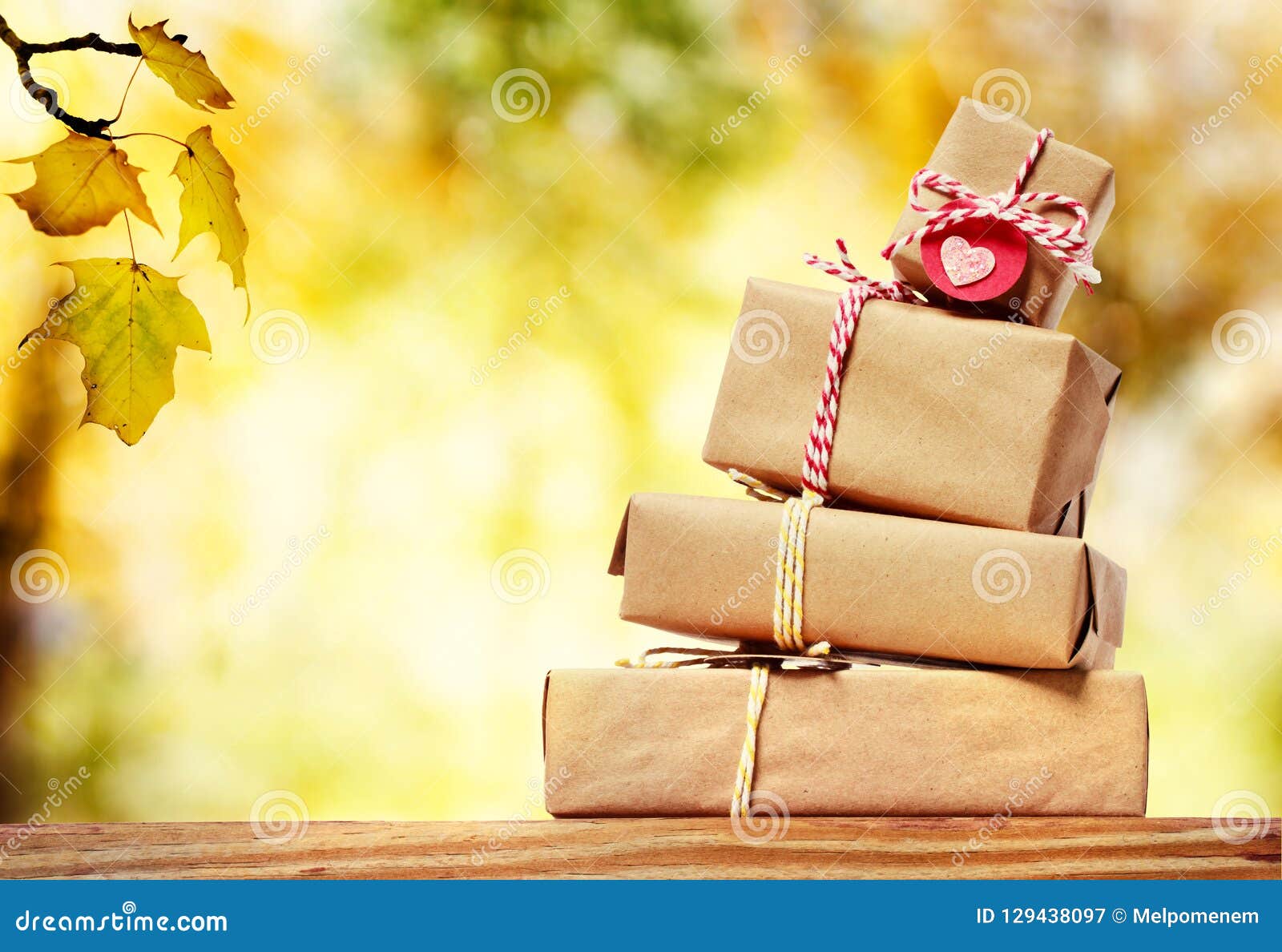 Stack of Gift Boxes with an Autumn Sky and Foliage Stock Image - Image ...