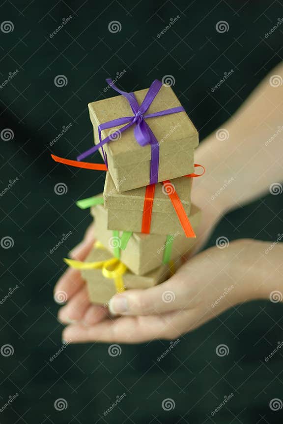 Stack of Gifts stock photo. Image of hands, package, occasion - 991046