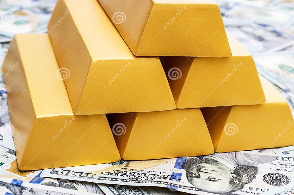 Stack of Gold Bullion on Background of Dollar Bills Stock Image - Image ...