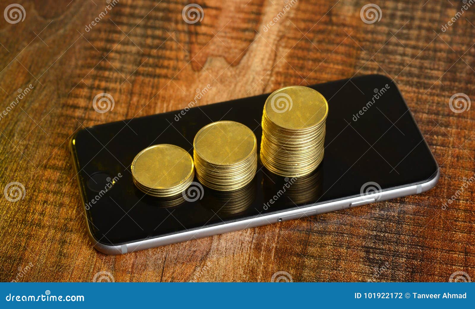 Stack of Golden Coins on Mobile Screen - Earning Concept Stock Photo ...