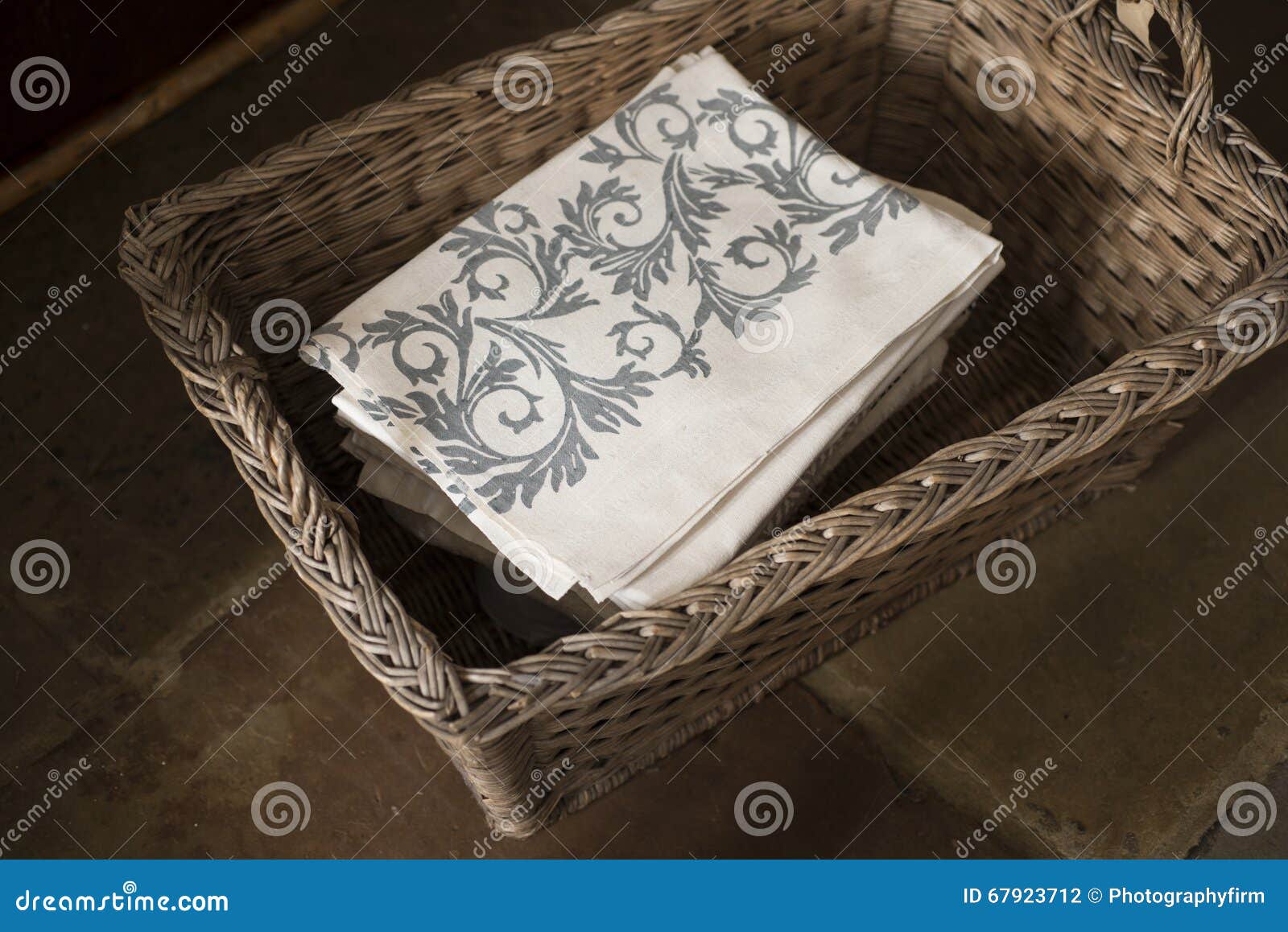Stack of Gray Floral Design Napkins in Rectangular Woven Basket Stock ...