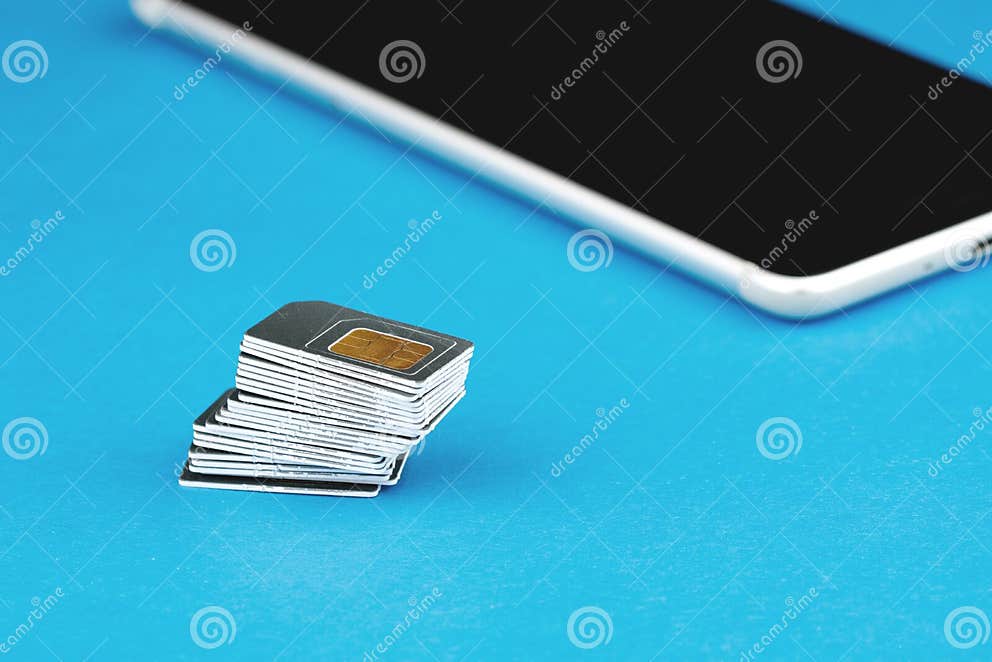 Stack of Gray SIM Cards on a Blue Background Stock Image - Image of ...