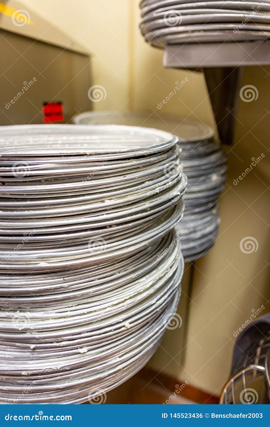 Stack of pizza pans stock photo. Image of kitchenware - 145523436