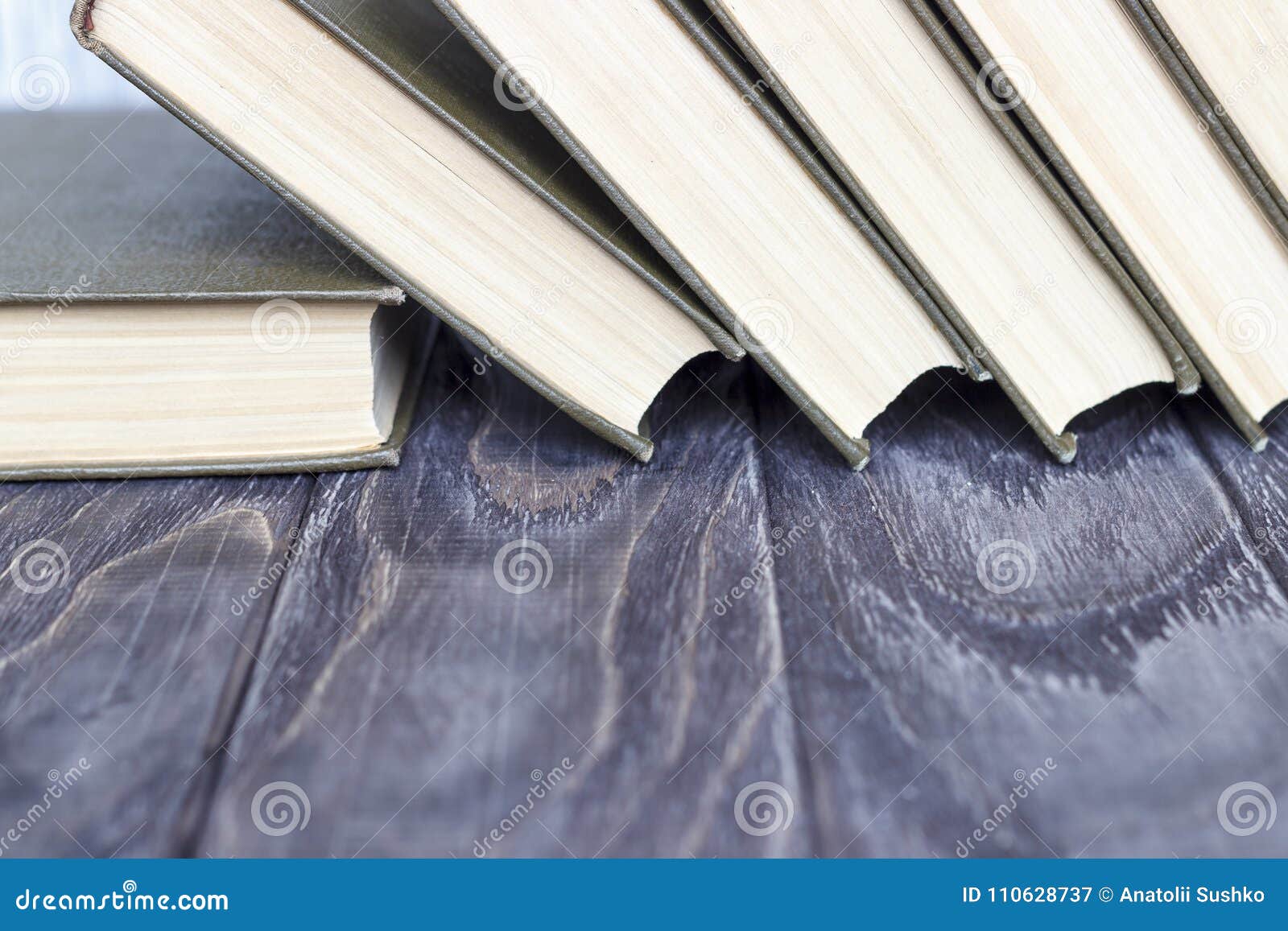 A Stack of Green Books on a Wooden Table. Concept of Reading Habits ...