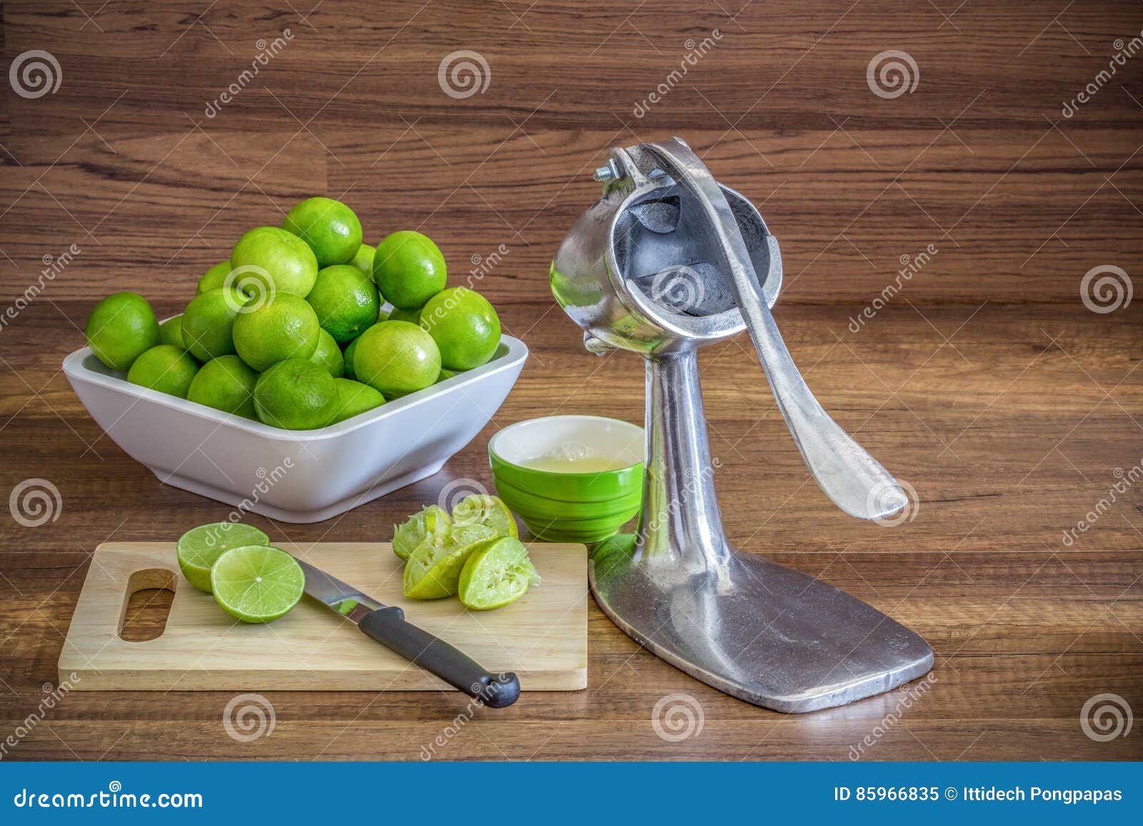 Stack of Green Lemon with Aluminum Manual Juicer Squeezer Fruit Stock ...
