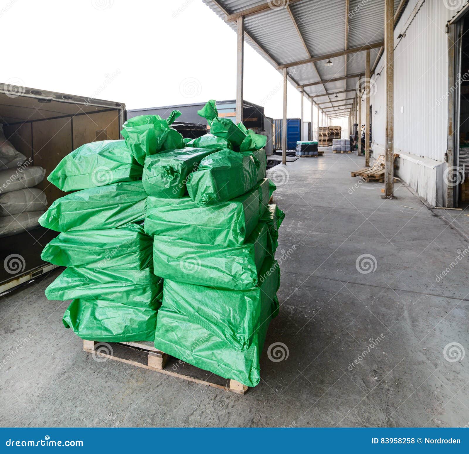 Stack of Green Sacks on a Pallet. Stock Photo - Image of winter ...