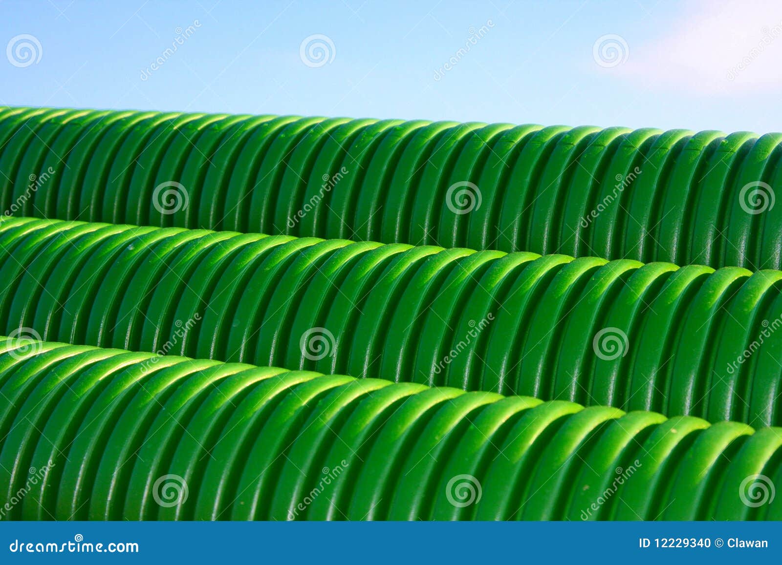 Stack of green tubes stock photo. Image of construction - 12229340