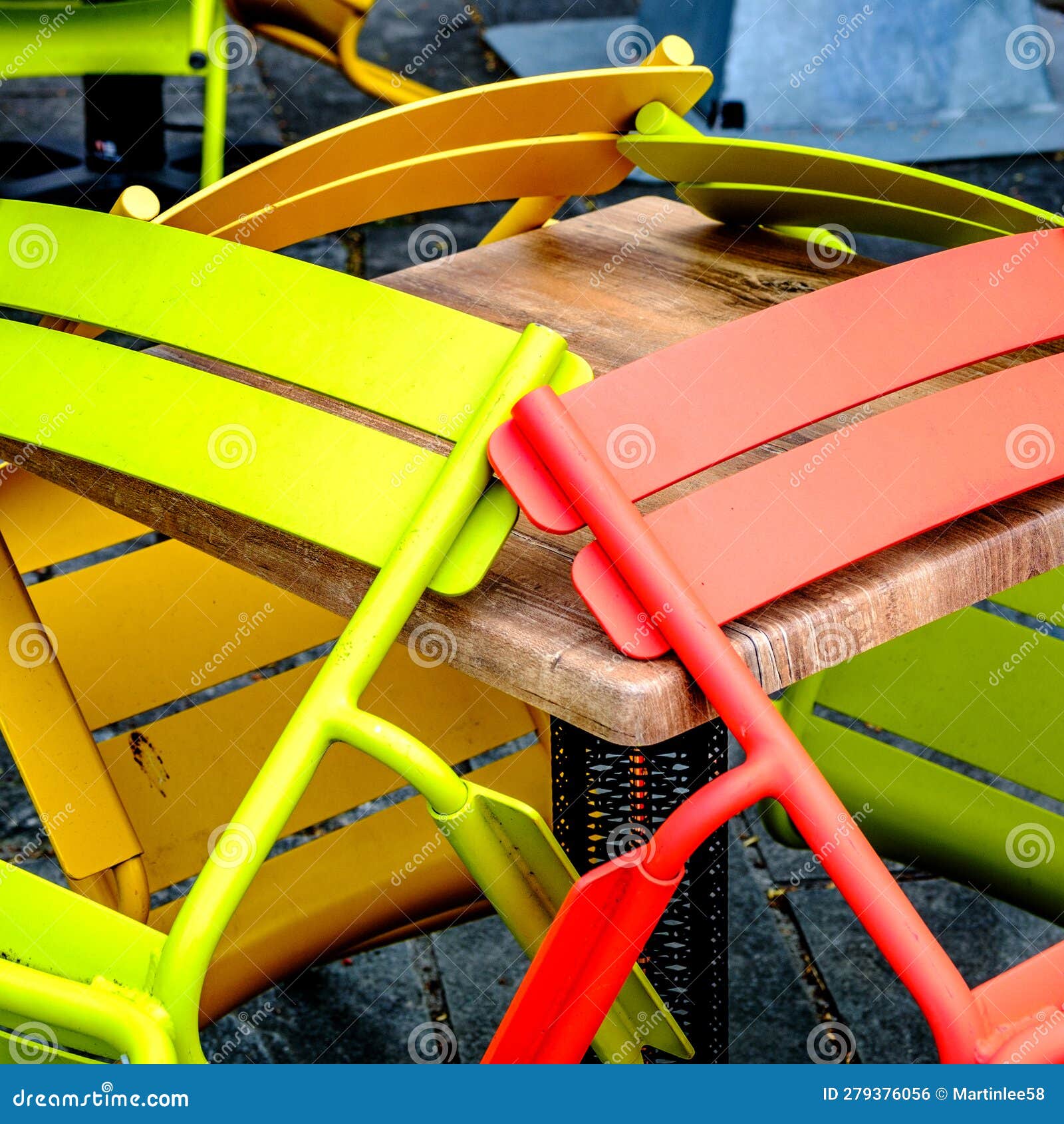 Stack or Group of Bright Coloured Chairs in a Cafe Outside Seating Area ...