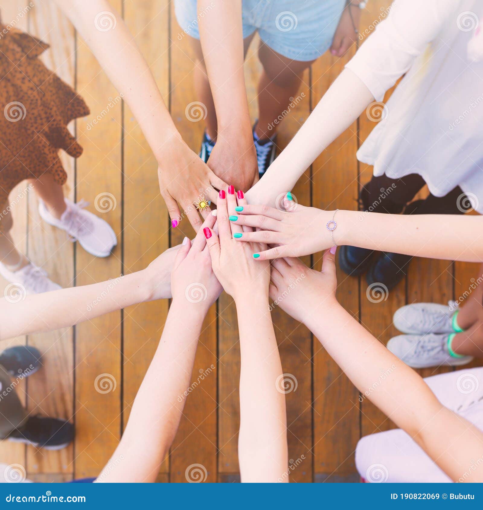 Unity And Teamwork Concept Where Four Doctors And Nurses In A Medical ...