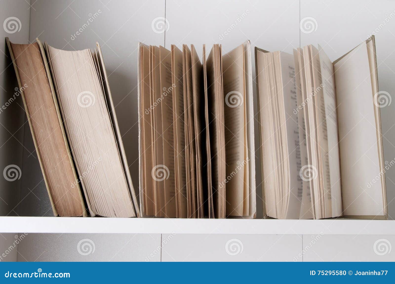 Stack of Hardback Books on Wooden Bookshelf Stock Photo - Image of ...
