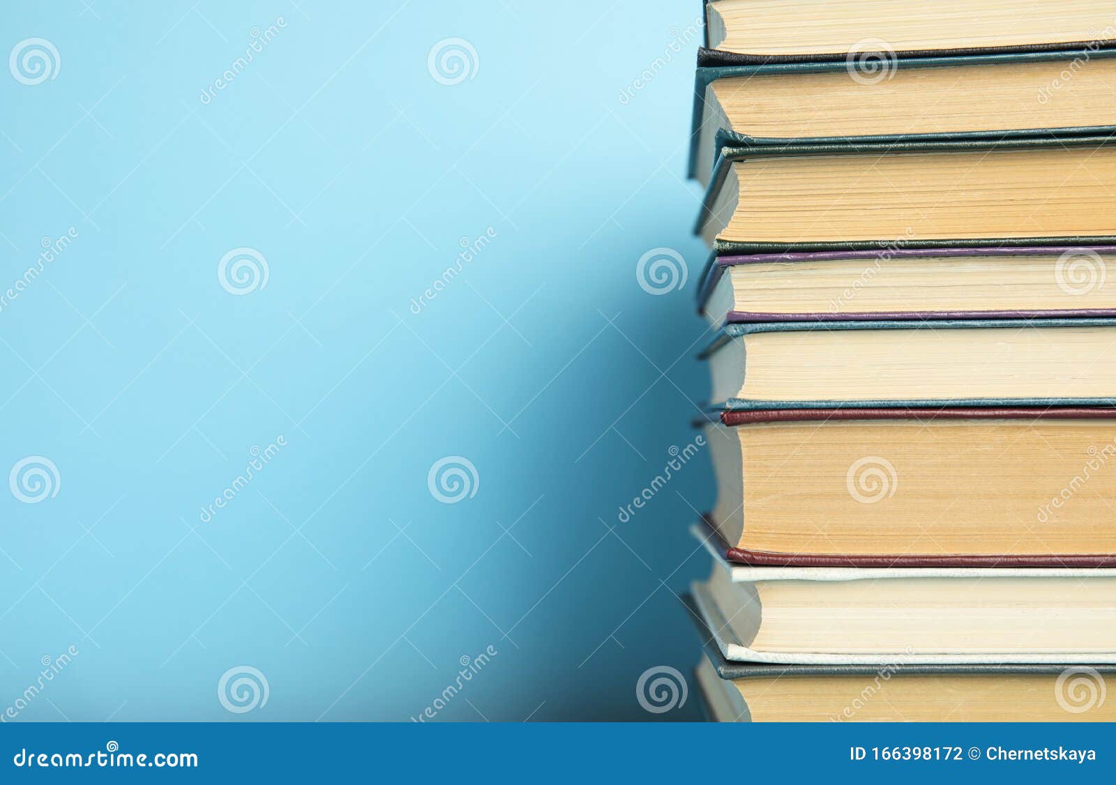 Stack of Hardcover Books on Blue Background, Space for Text Stock Photo ...