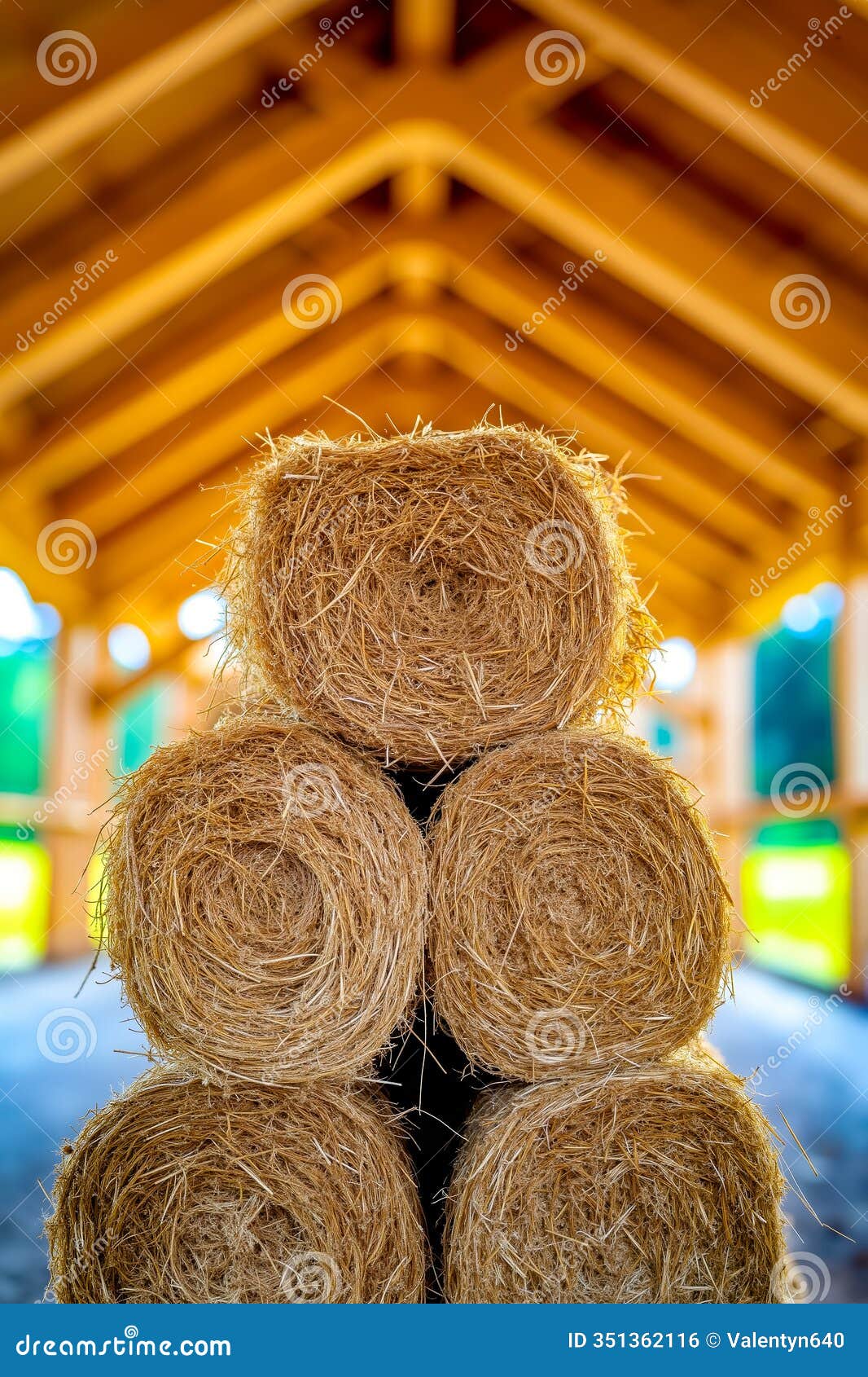 A Stack of Hay Bales Stacked on Top of Each Other in a Barn Stock Photo ...