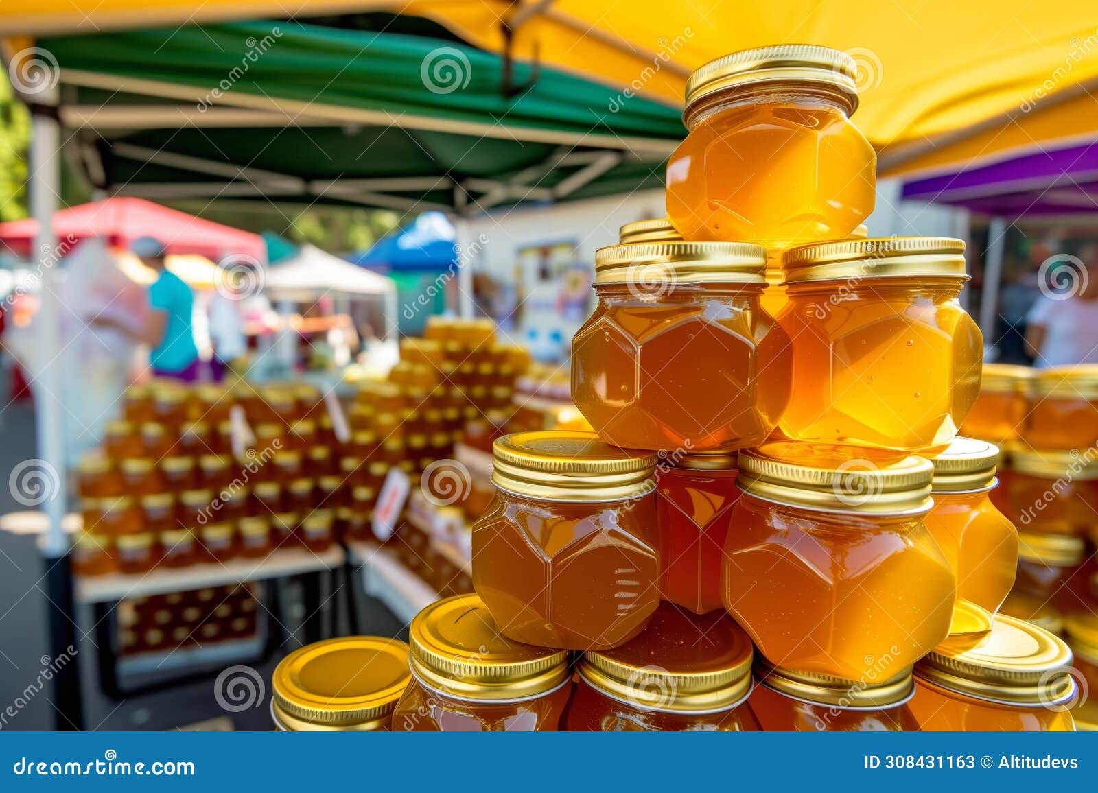 Stack of Hexagonal Honey Jars Displayed in Front of a Market Stall Tent ...