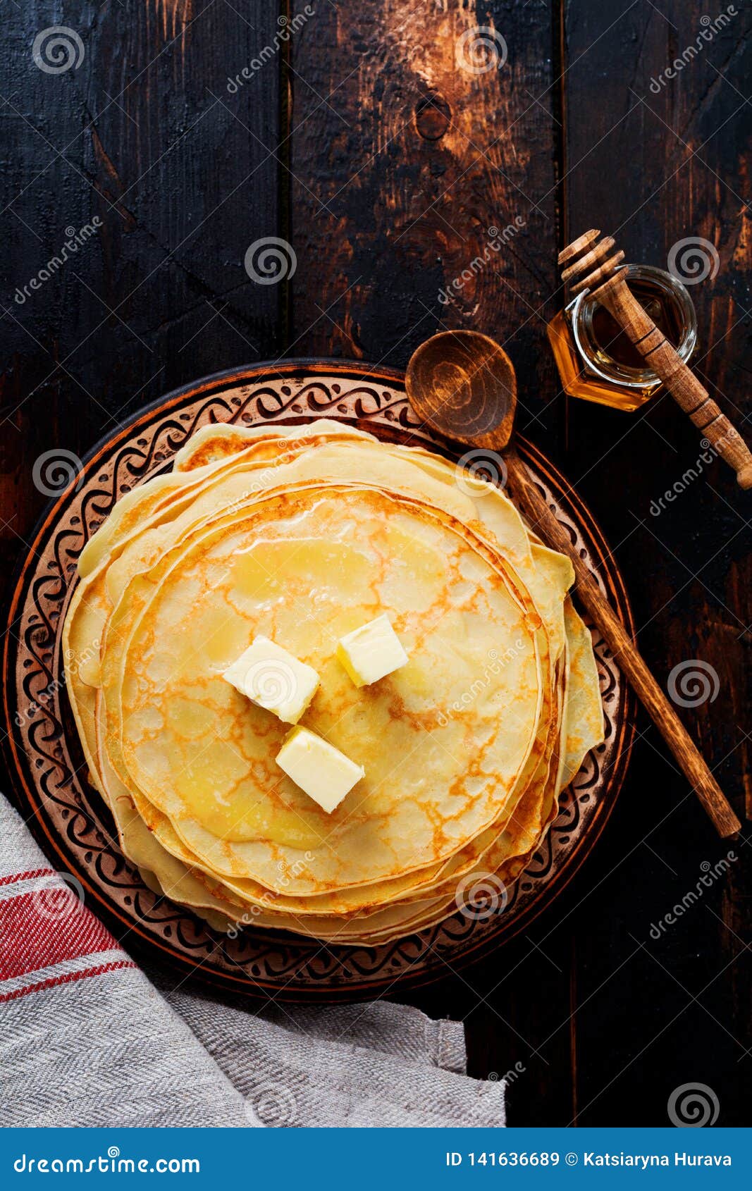 Stack of Homemade Thin Pancakes with Pieces of Butter, Milk and Honey ...