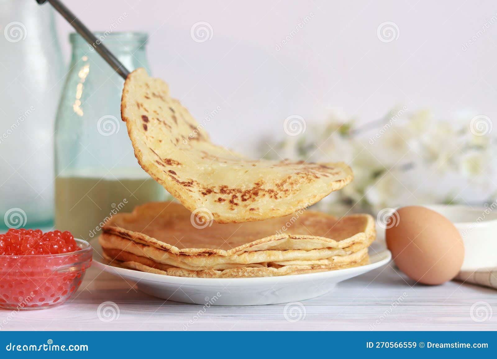 A Stack of Hot Pancakes. Put a New Crepes on a Stack of Ready-made ...
