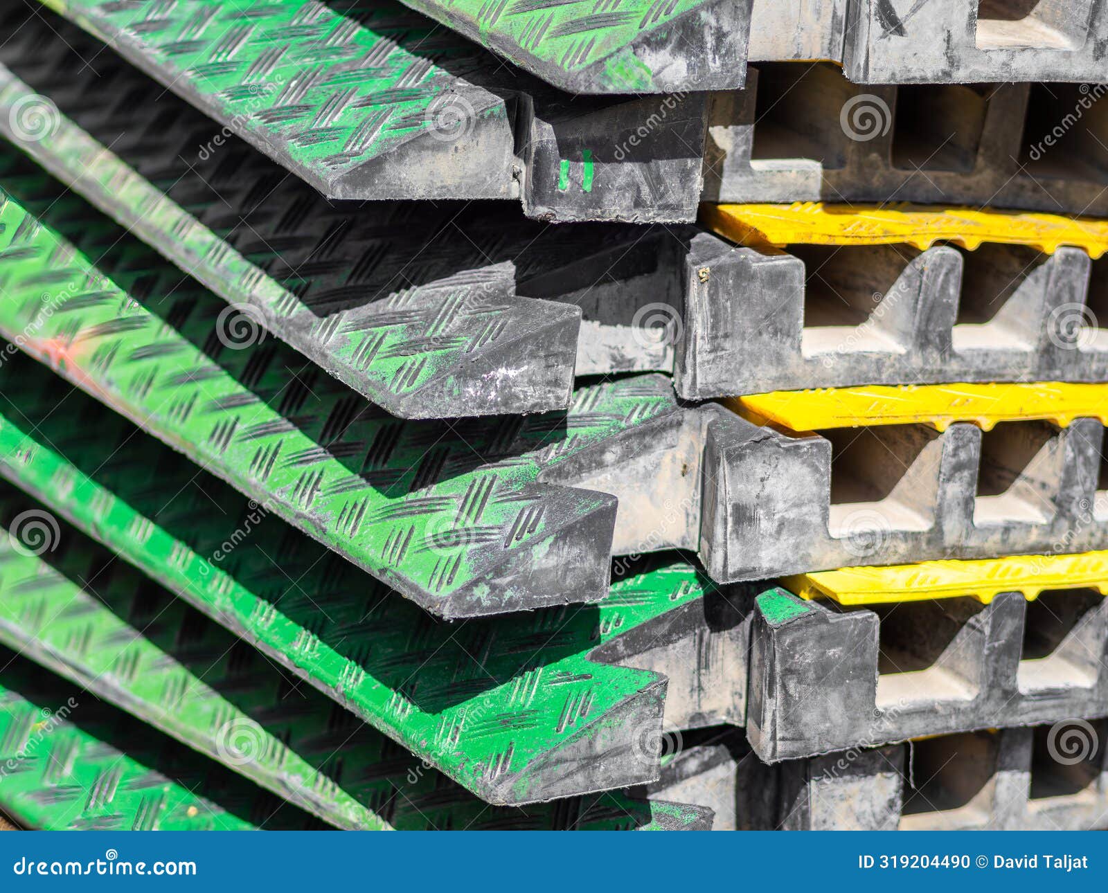 A Stack of Interlocking Green and Yellow Panels Stock Photo - Image of ...