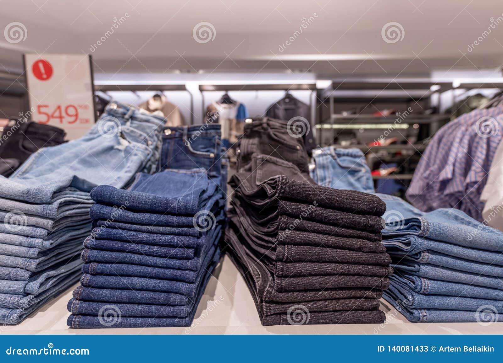 Stack of Jeans in the Store. Shopping Mall. Shopping Concept Stock ...