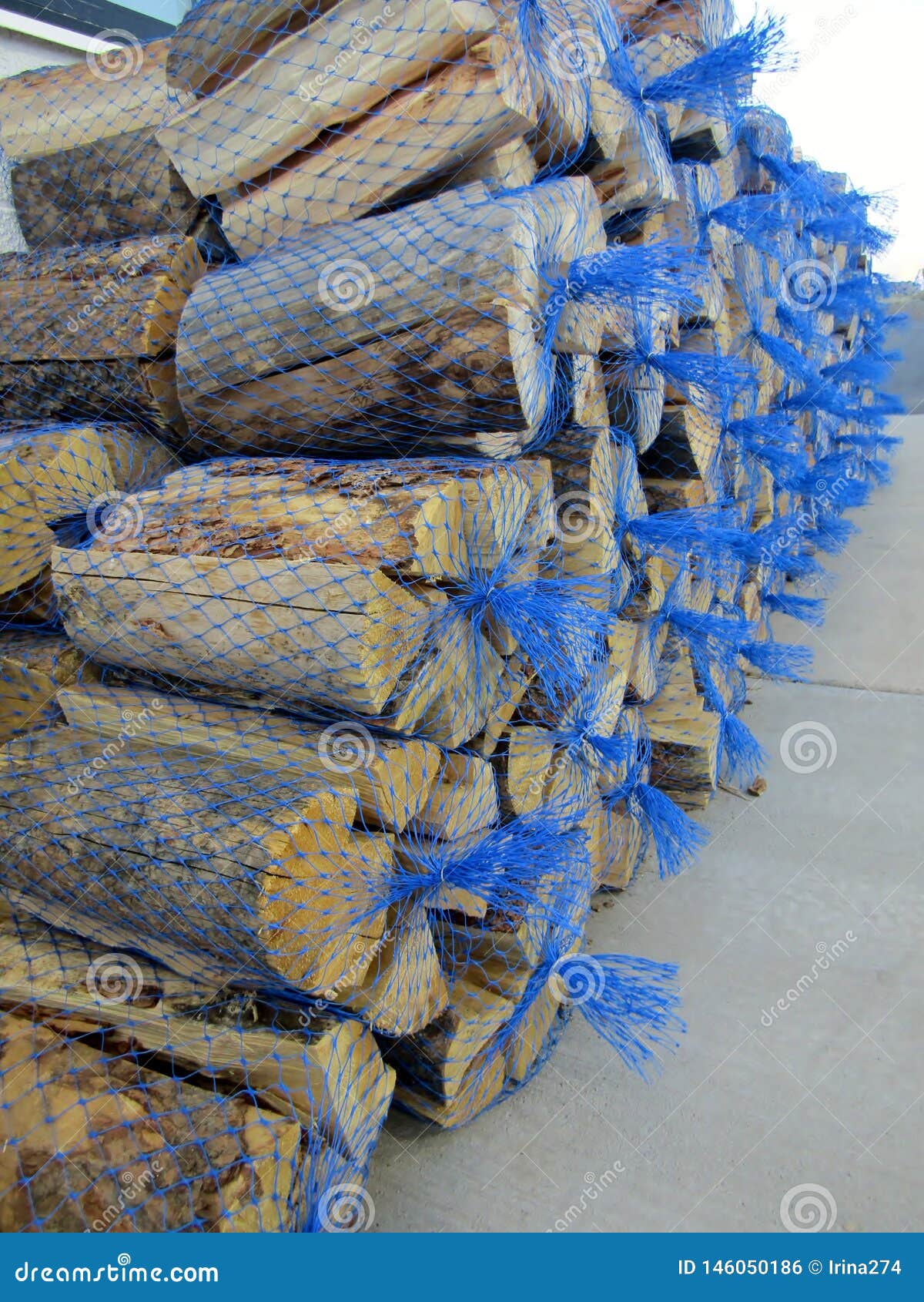 Stack of Kiln Dried Logs in Net Bags Stock Photo - Image of comfortable ...