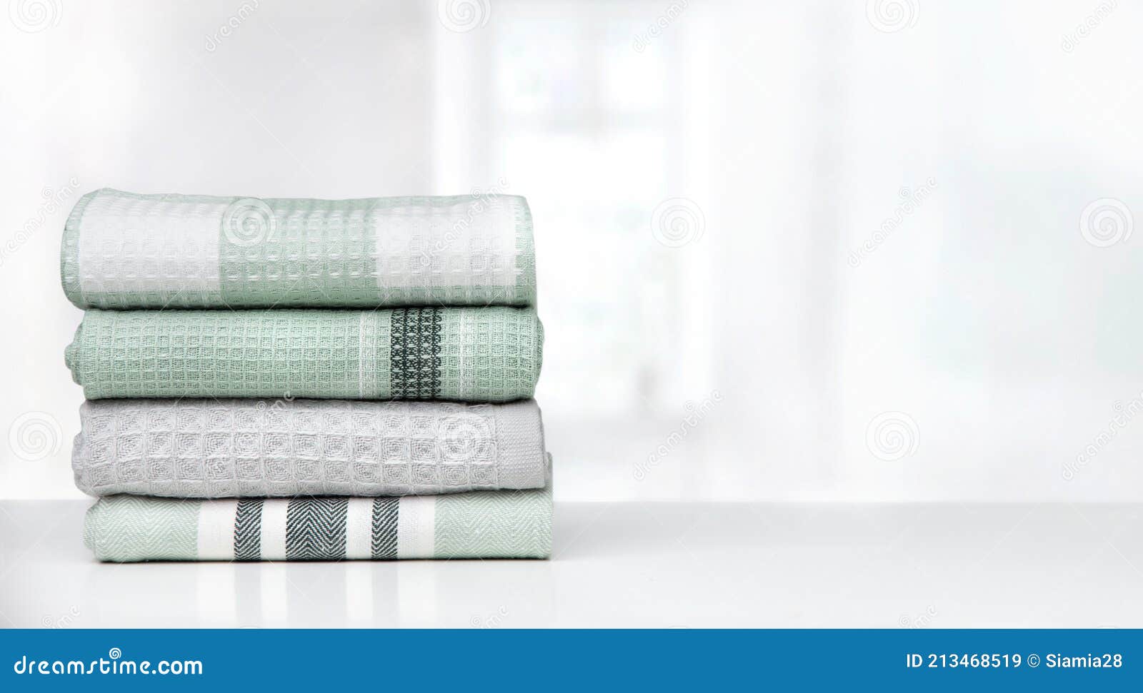 A Stack of Kitchen Towels on the Table Stock Image - Image of color ...