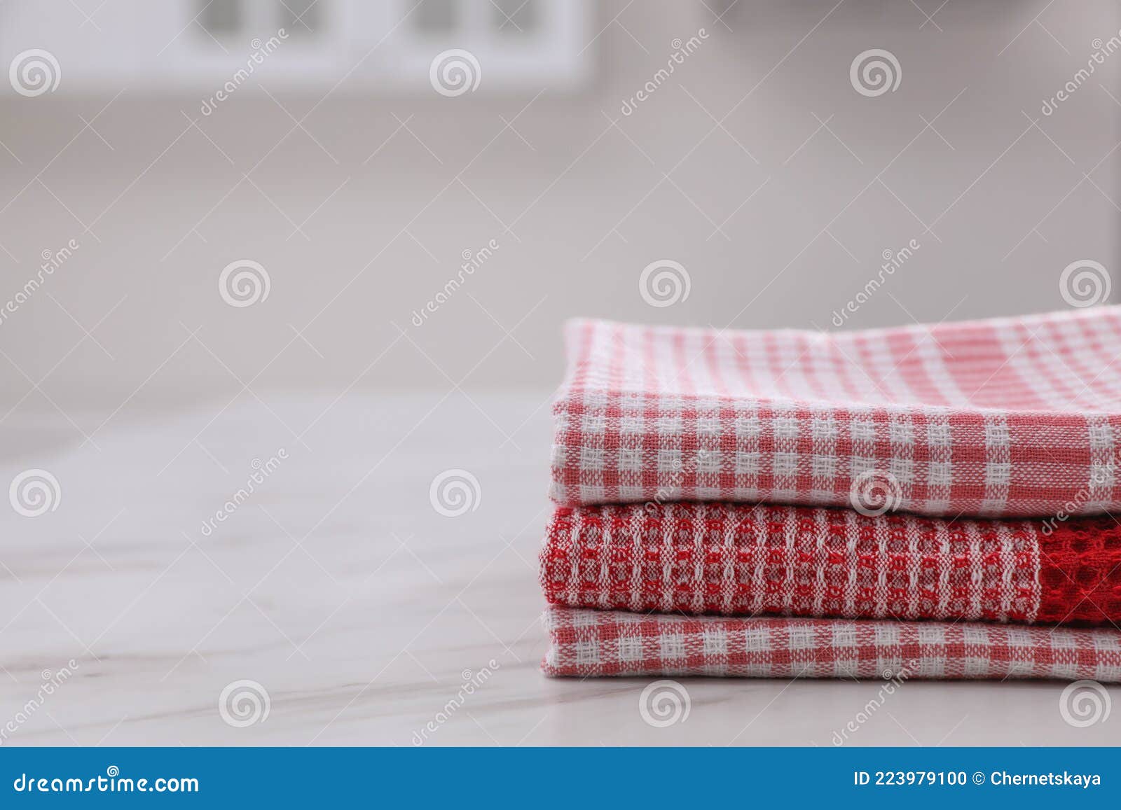 Stack of Kitchen Towels on White Marble Table. Space for Text Stock ...