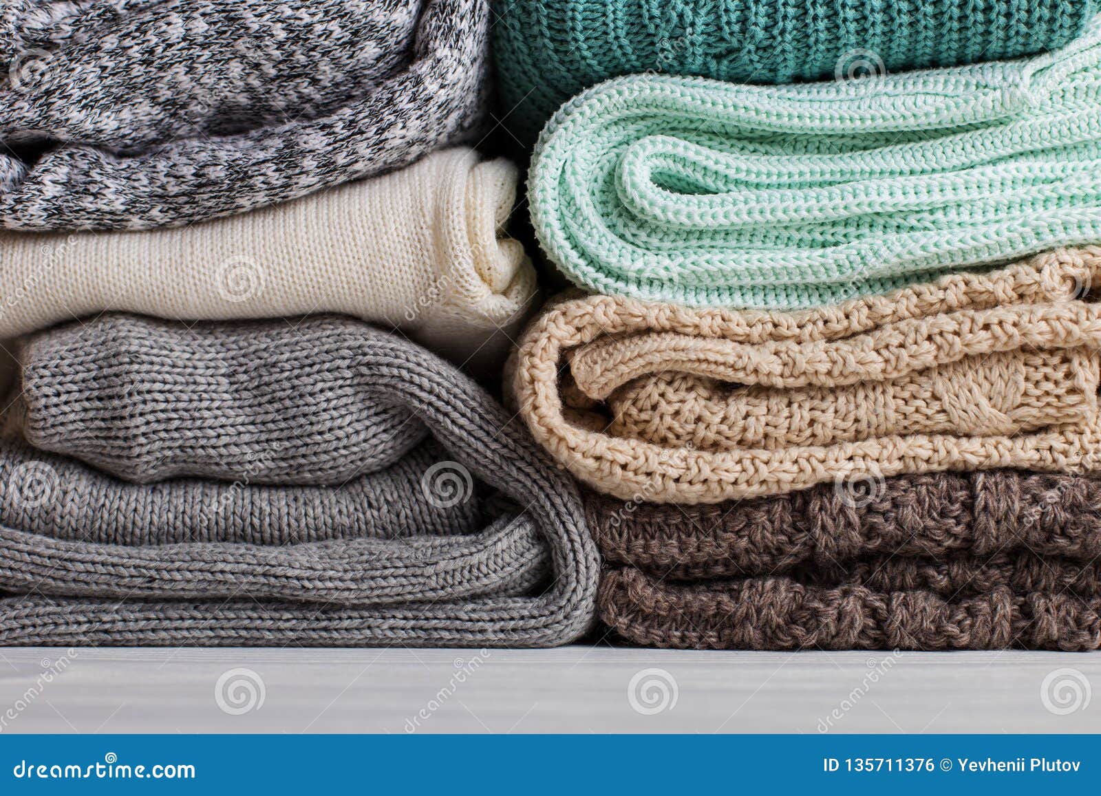 A Stack of Knitted Clothes of Different Colors and Textures Stock Photo ...