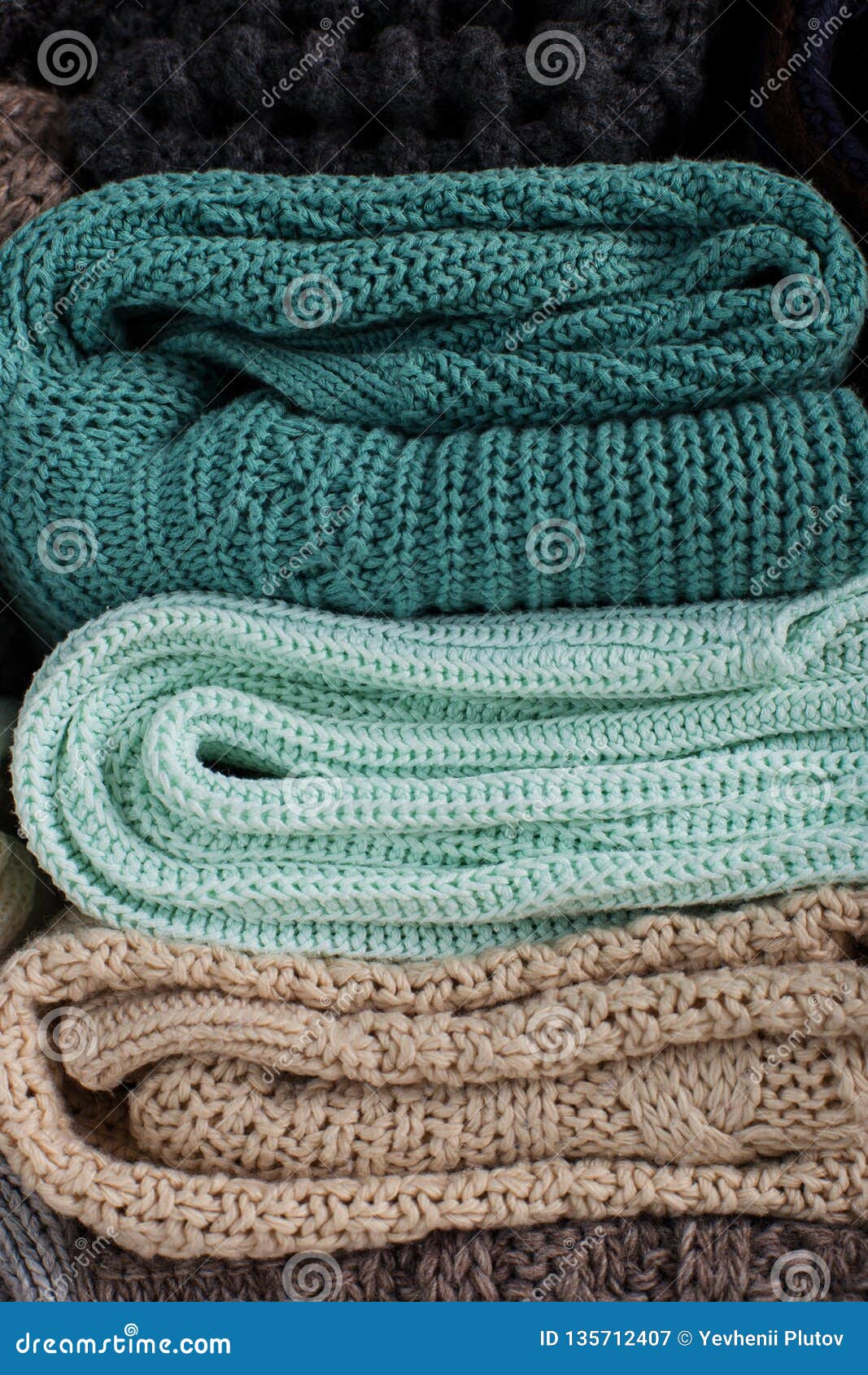 A Stack of Knitted Clothes of Different Colors and Textures Stock Image ...