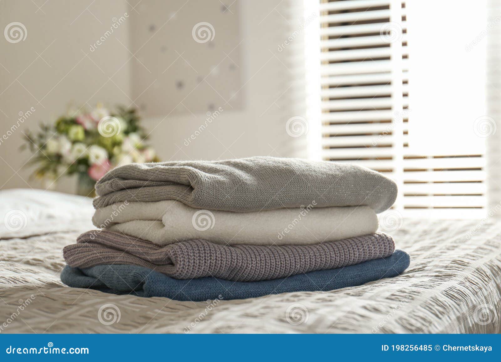 Stack of Knitted Sweaters on Bed Indoors Stock Image - Image of heap ...