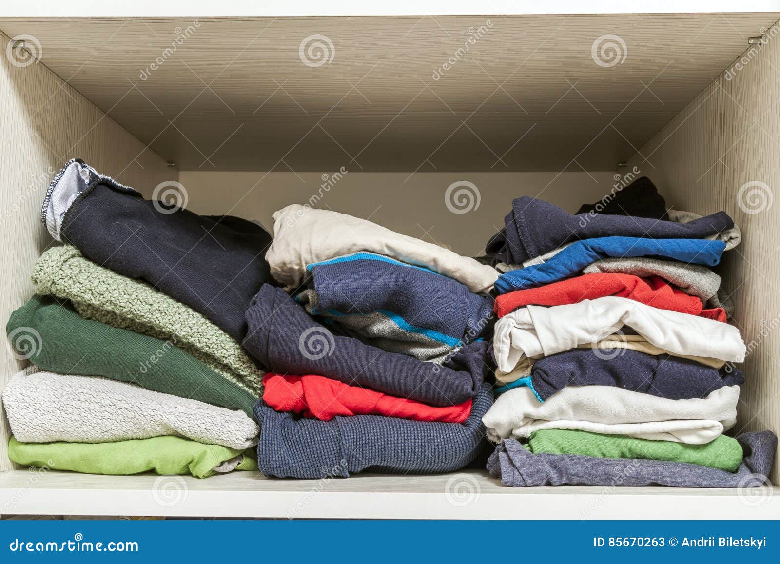 A Stack of Knitted Warm Woolen Clothes in Wardrobe Close Stock Image ...