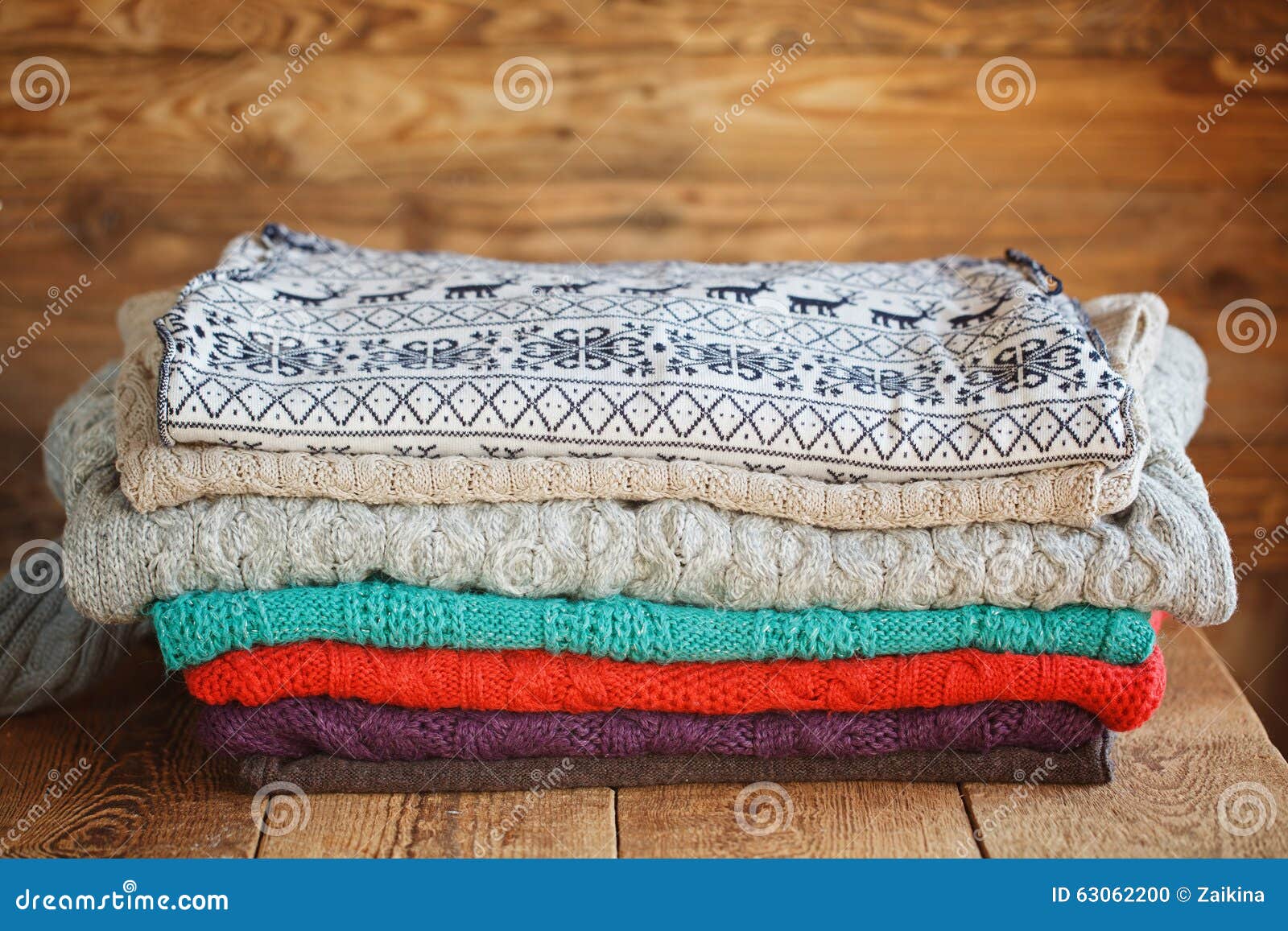 Stack of Knitting Colorful Warm Woolen Clothes on Wooden Wall B Stock ...