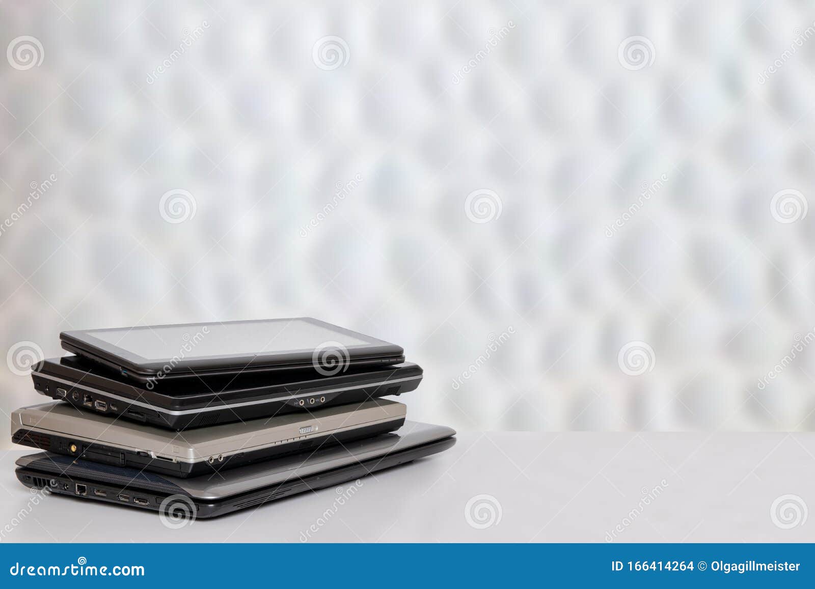 Stack of Laptop Computers. a Pile of Computers on a Bright Table ...