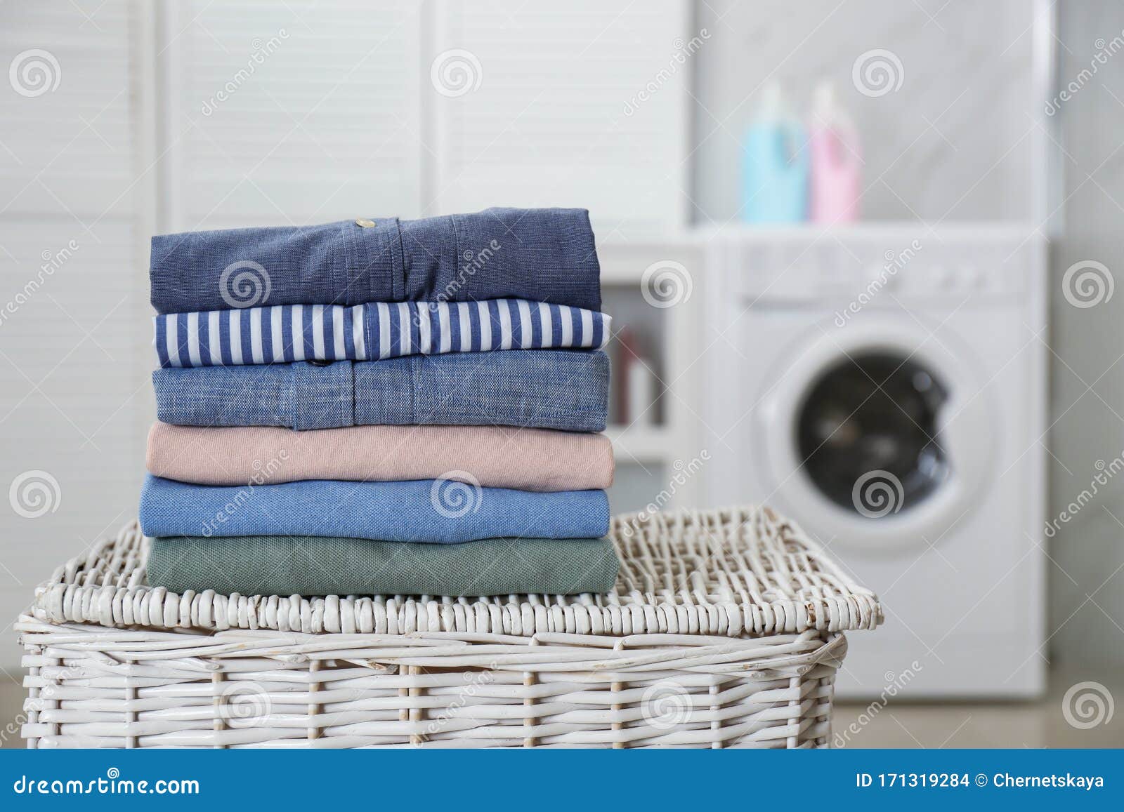 Stack of Laundry on Basket in Bathroom Stock Photo - Image of color ...