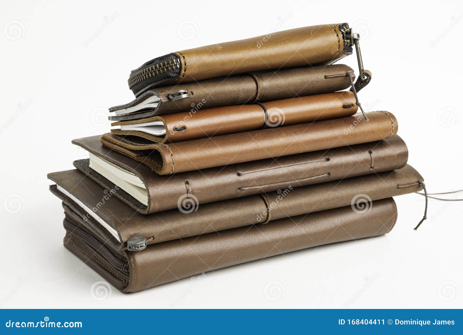 A Stack of Leather-Bound Journals, Notebooks, Wallets & Cases Stock ...